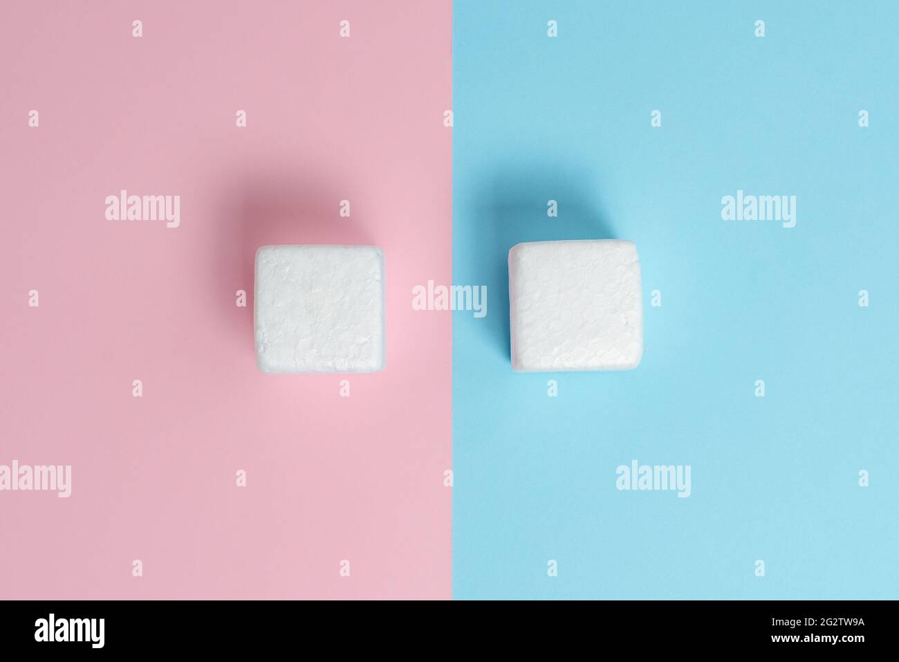 Two Objects Arranged Facing Inward Outward On a Separated Coloured ...