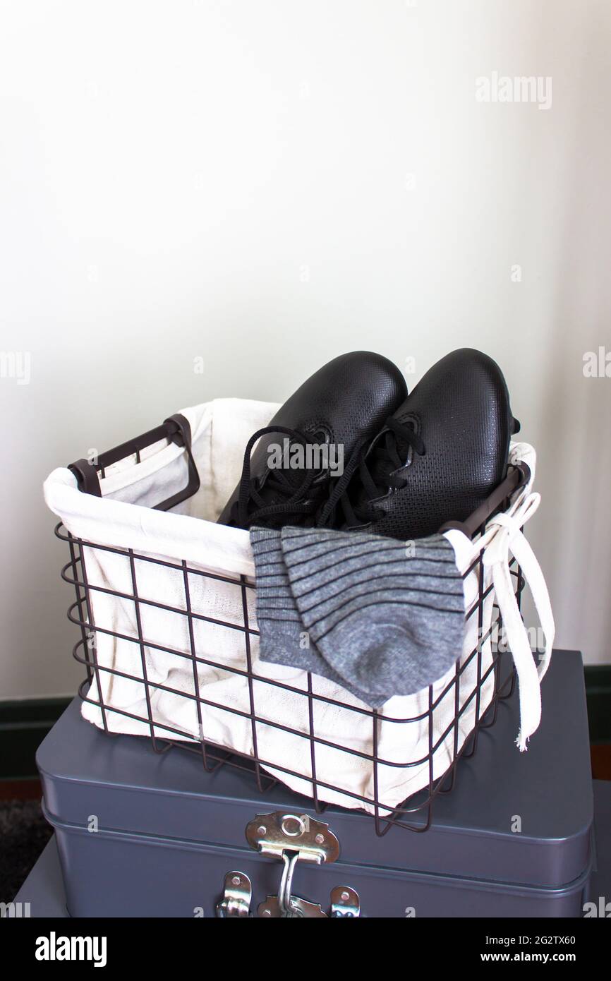 Football shoes in basket with copy space Stock Photo - Alamy