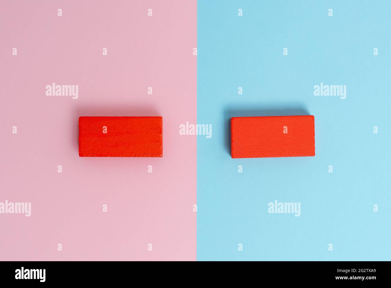 Two Objects Arranged Facing Inward Outward On a Separated Coloured ...