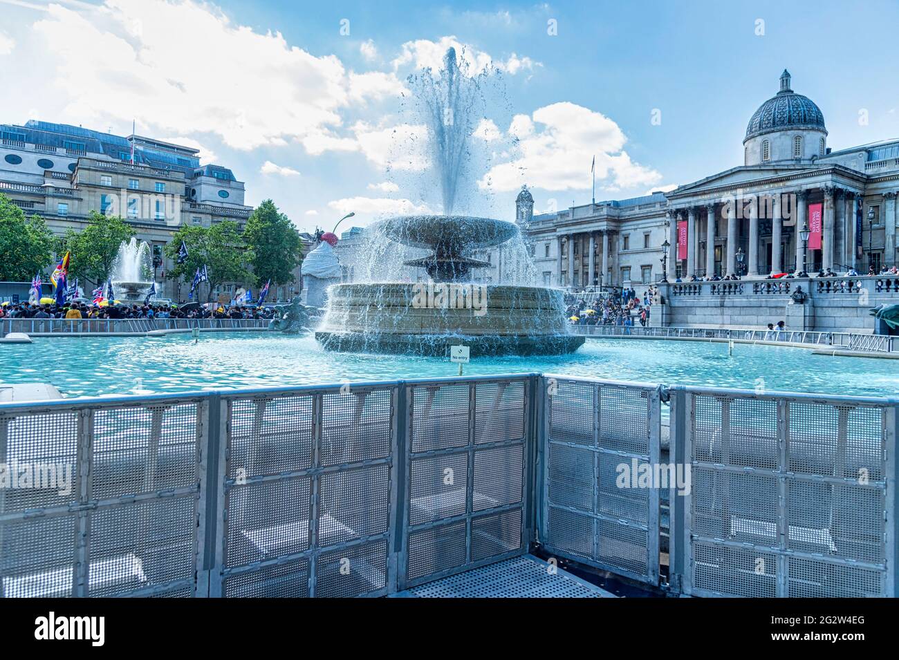 Crowd barriers around the fountains in Trafalgar Square as construction ...