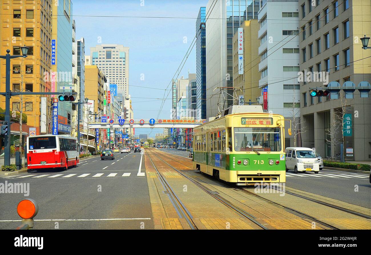 Tramway and bus in one street of Hiroshima, Japan, 02-15-2015 Stock ...