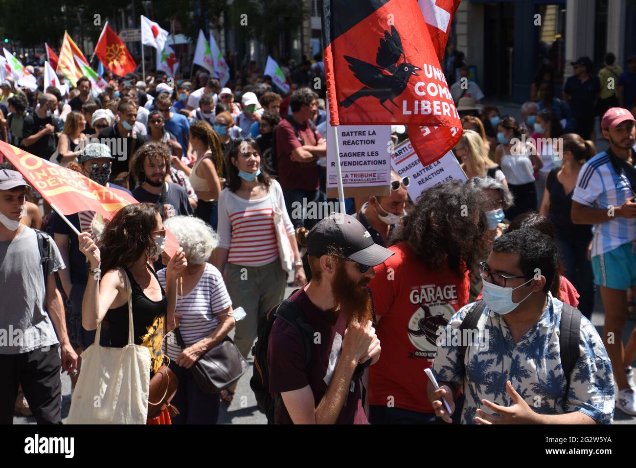 Crowd of protesters seen with flags and placards, during the march.More ...