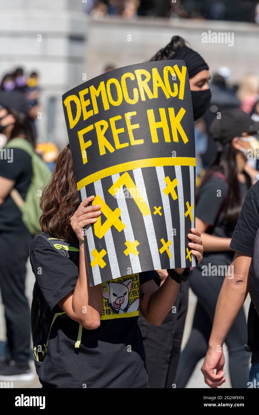 An activist holds a placard in Trafalgar Square during a rally marking ...