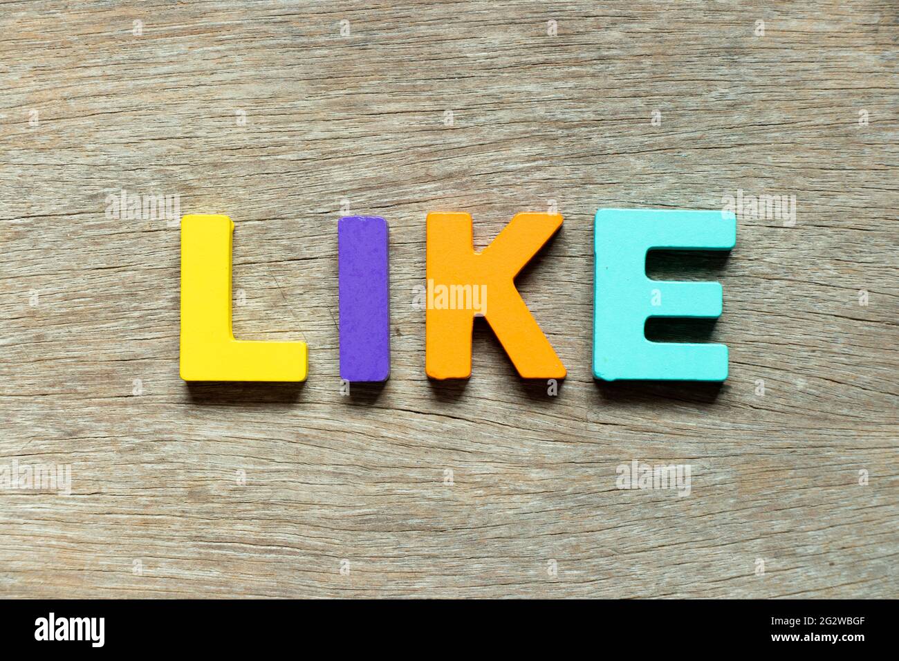 Color alphabet letter in word like on wood background Stock Photo - Alamy