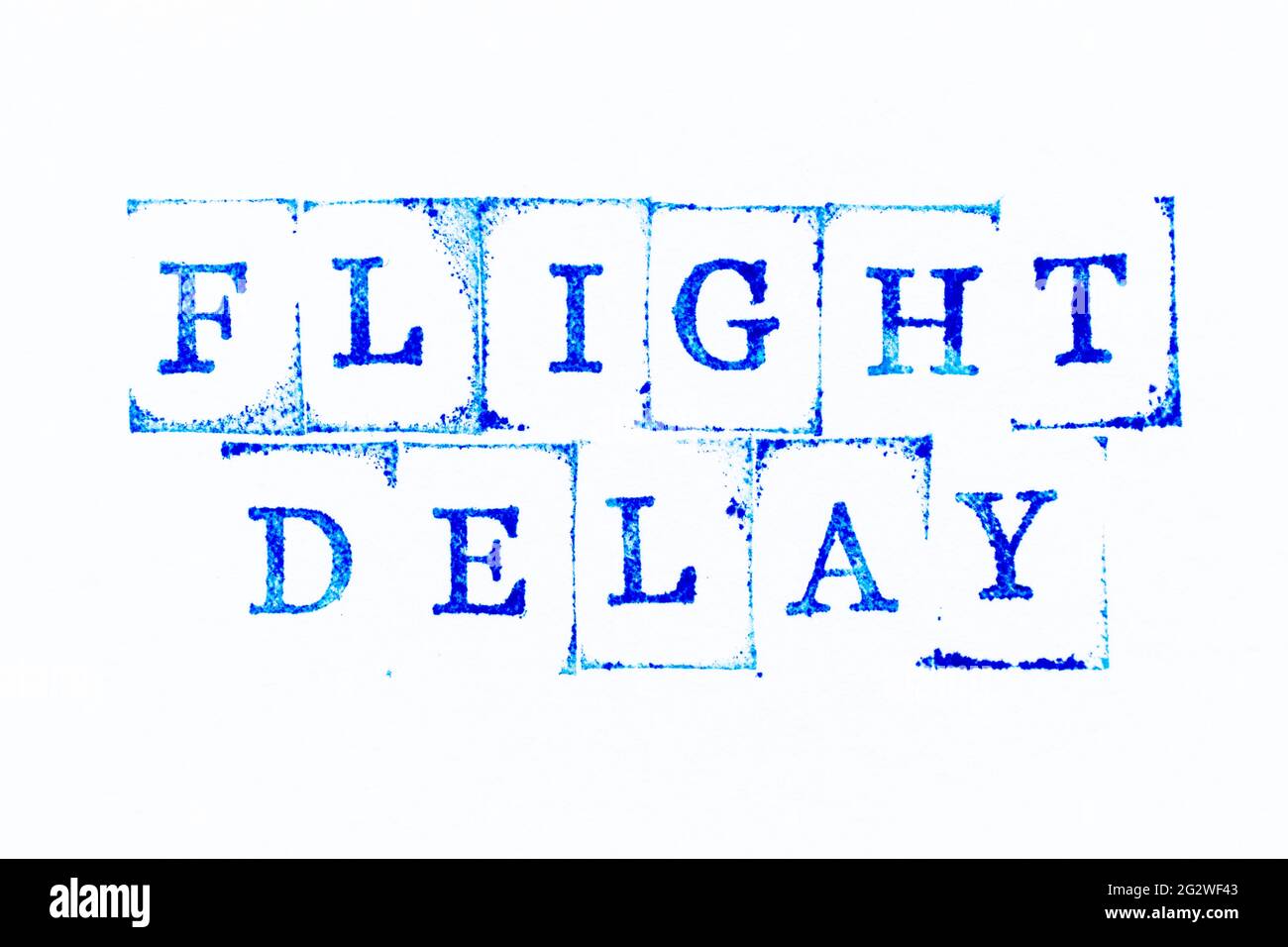 Blue color ink rubber stamp in word flight delay on white paper ...