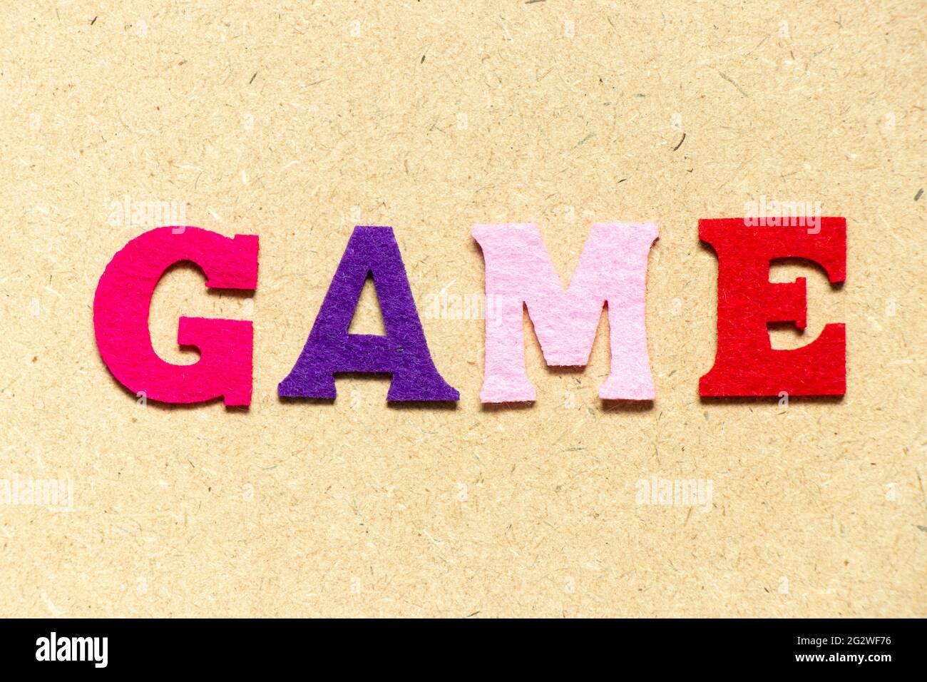 Color cloth alphabet letter in word game on wood background Stock Photo ...