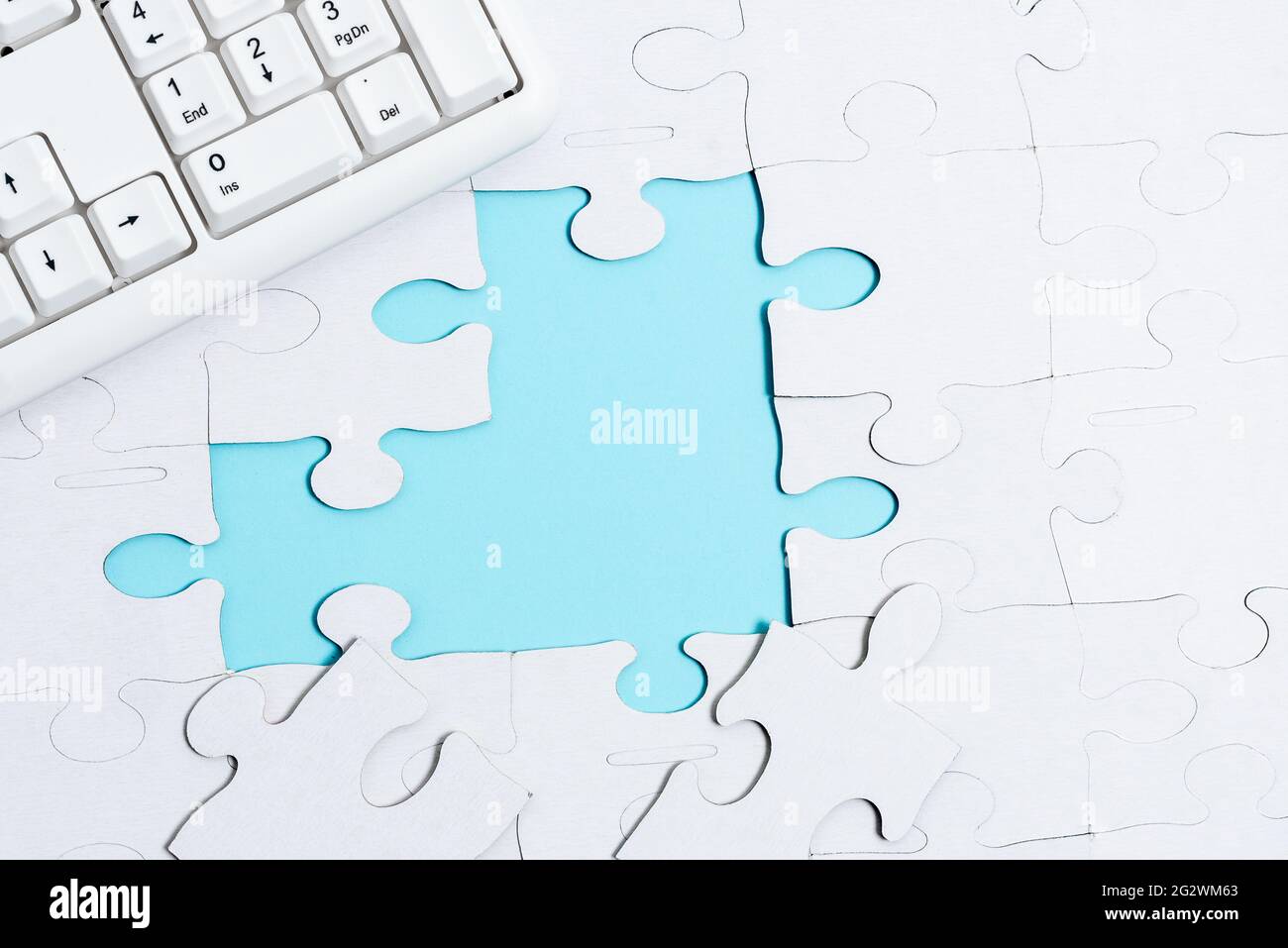 Building An Unfinished White Jigsaw Pattern Puzzle With Missing Last ...