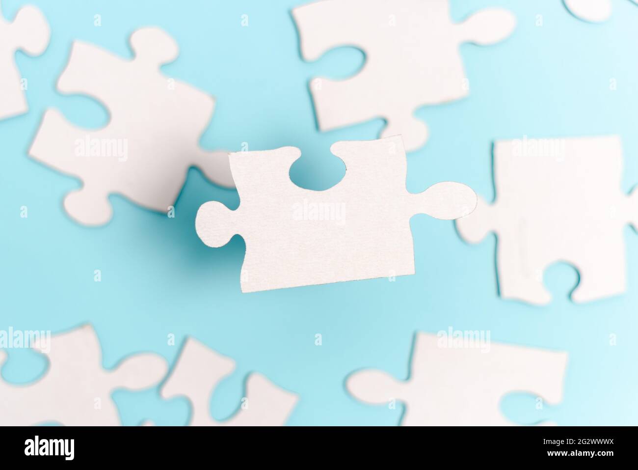 Building An Unfinished White Jigsaw Pattern Puzzle With Missing Last ...