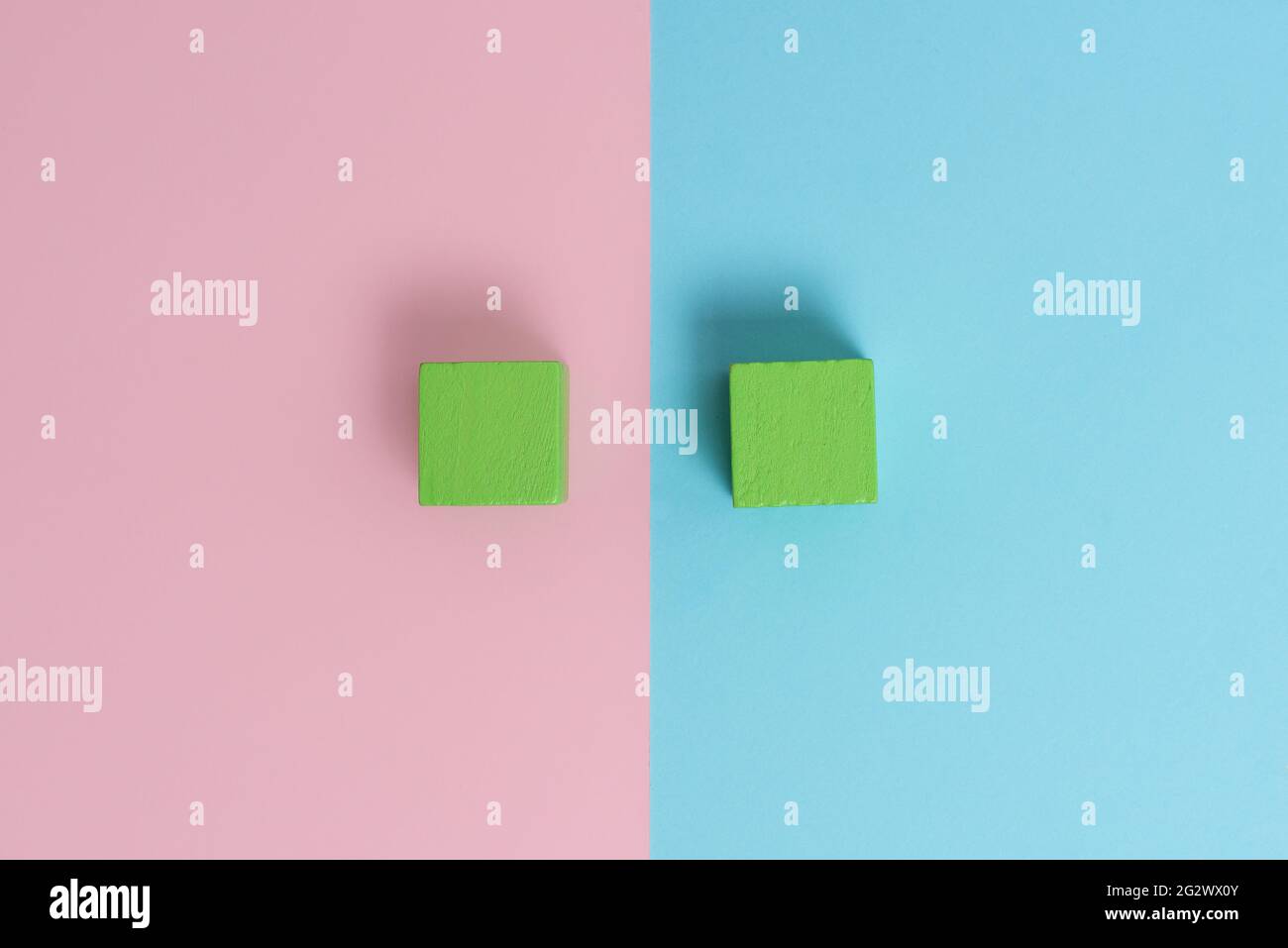 Two Objects Arranged Facing Inward Outward On a Separated Coloured ...