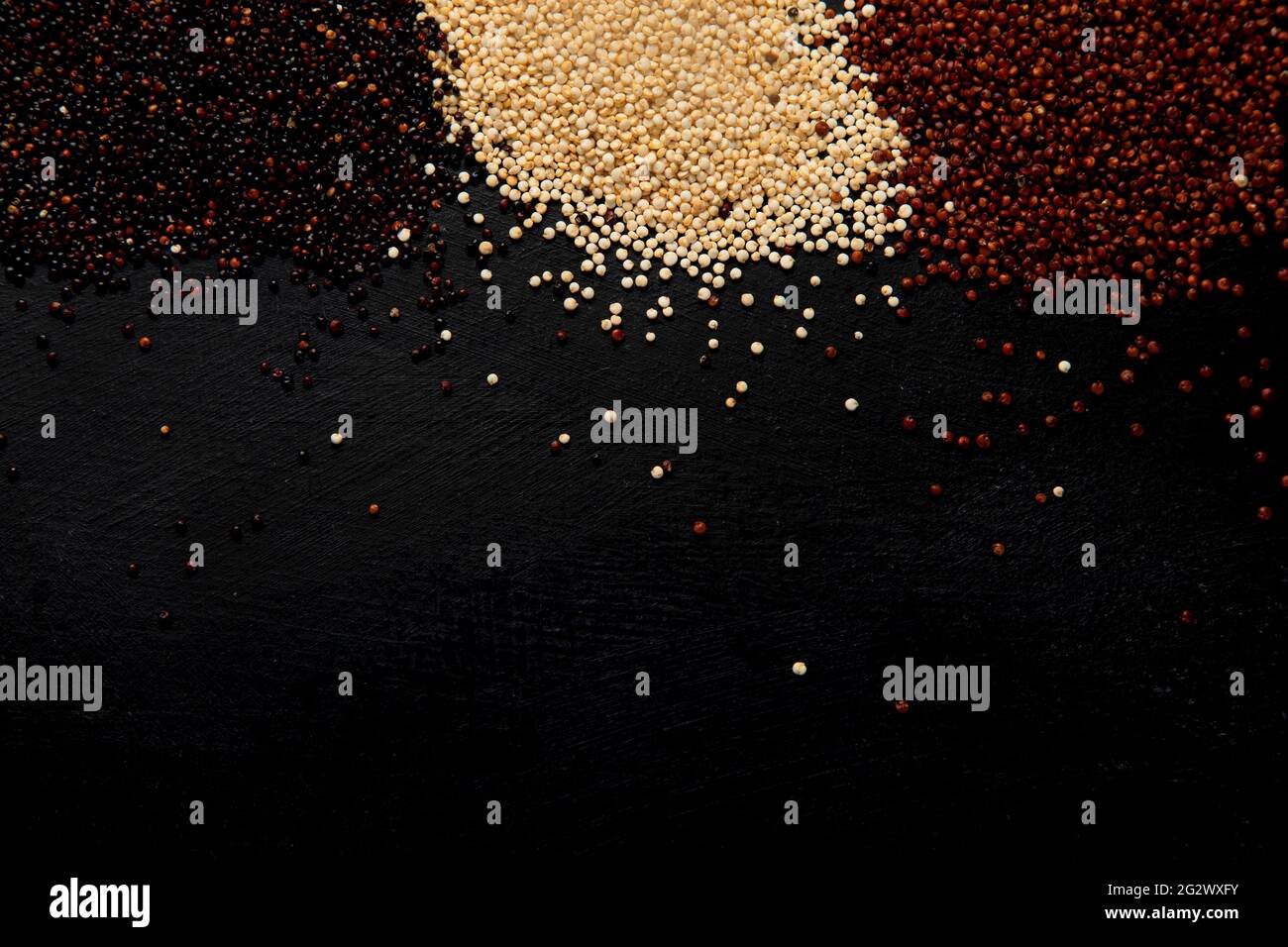 Set with different types of quinoa on dark background. Organic food ...