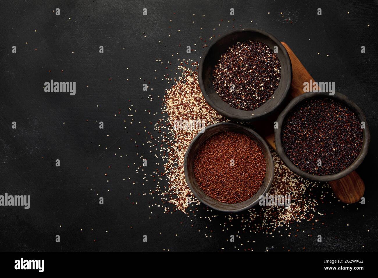Set with different types of quinoa on dark background. Organic food ...