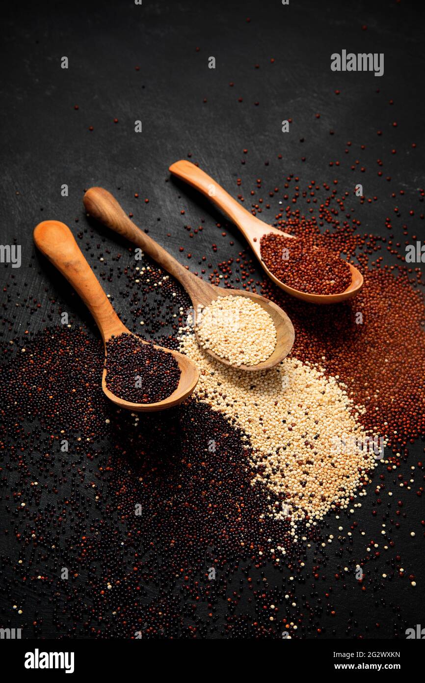 Set with different types of quinoa on dark background. Organic food ...