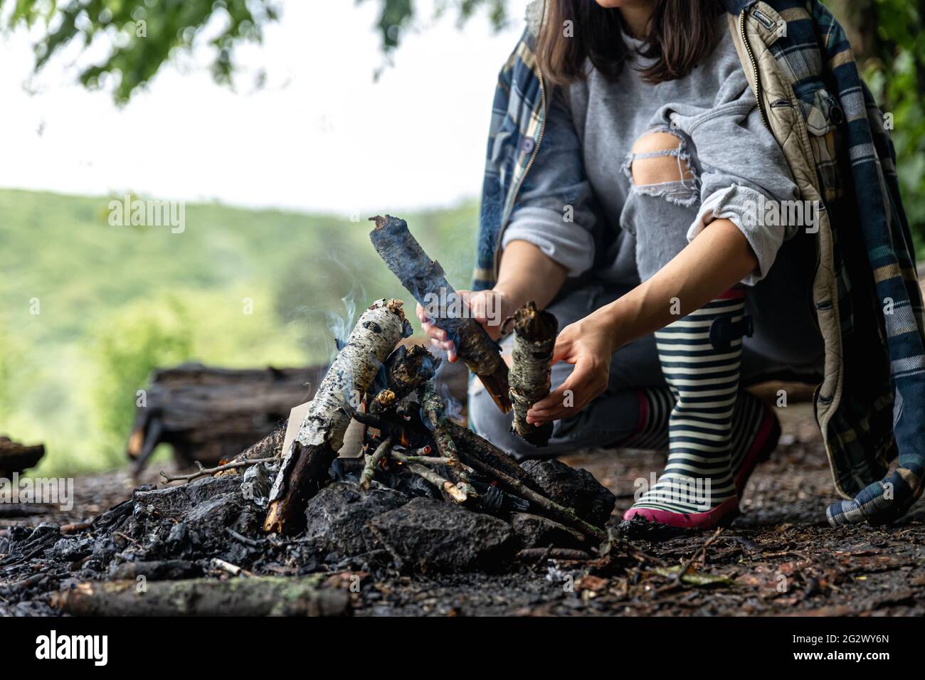 The process of making a fire in nature in the forest Stock Photo - Alamy