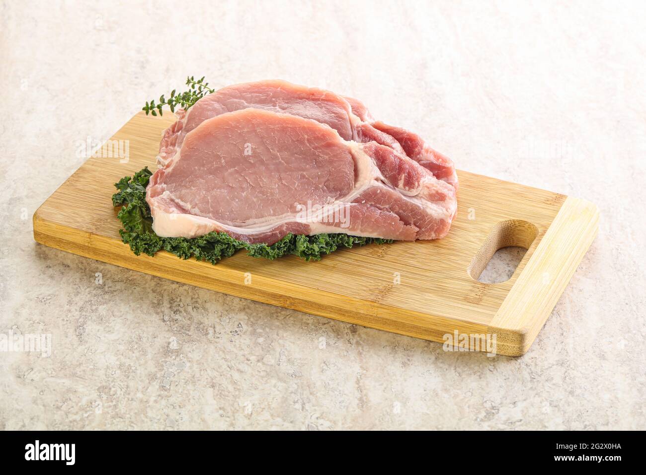 Raw pork loin for coocking over board Stock Photo - Alamy