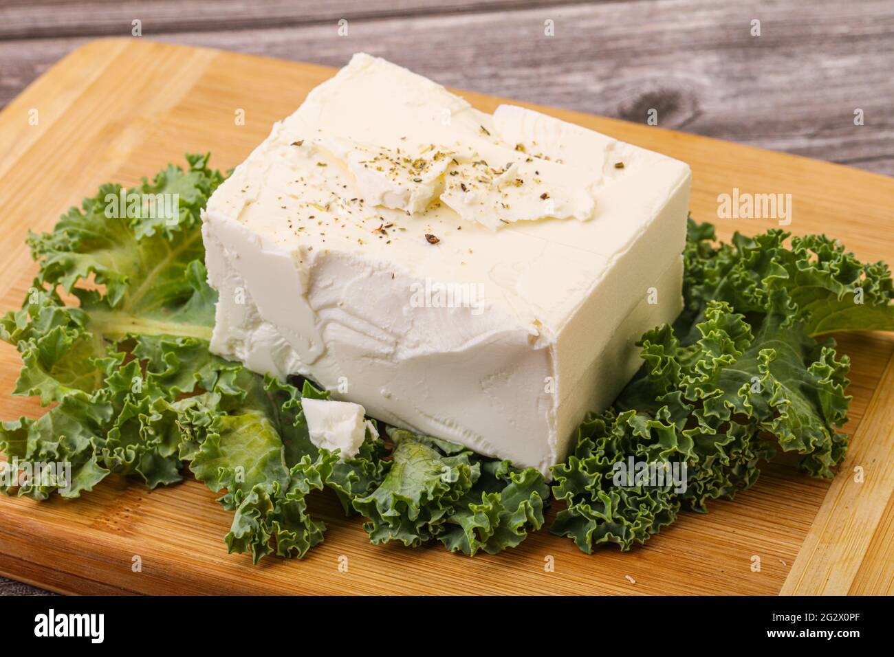Traditional tasty Greek Feta soft cheese brick Stock Photo - Alamy