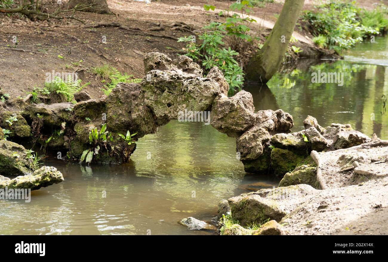 Small stone bridge over a woodland stream Stock Photo - Alamy