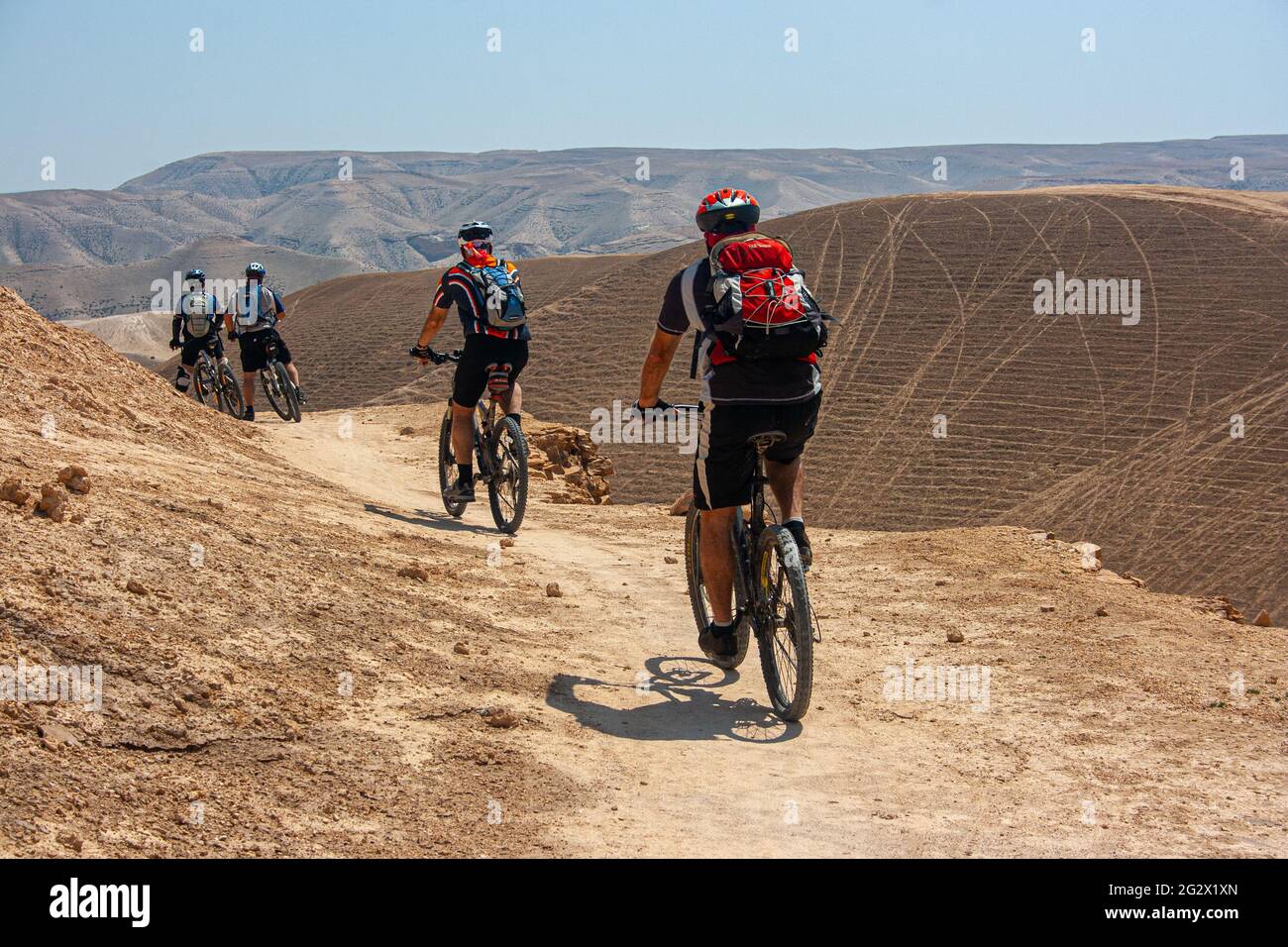 Group of off road cyclists Extreme sports in the Judaean Desert Stock ...