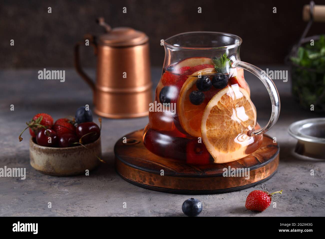 fruit berry tea in a teapot Stock Photo - Alamy