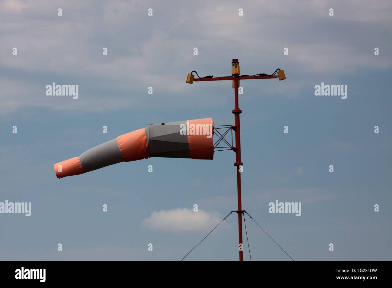 Aviation concept - wind sock on a flying field of an airport close up ...