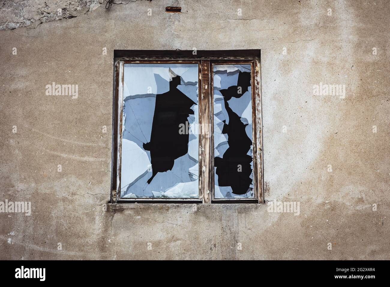 A window with a broken glass in an old building Stock Photo - Alamy