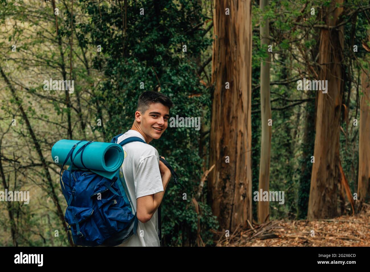 Boy backpack trees teenager hi-res stock photography and images - Alamy
