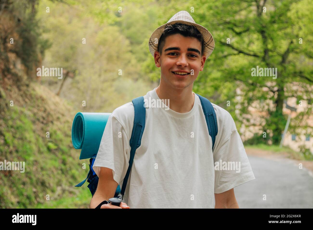 Boy backpack trees teenager hi-res stock photography and images - Alamy