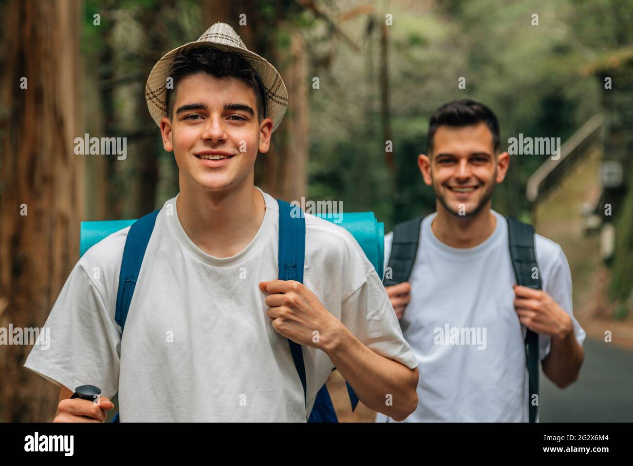 young people hiking, excursion or trekking Stock Photo - Alamy