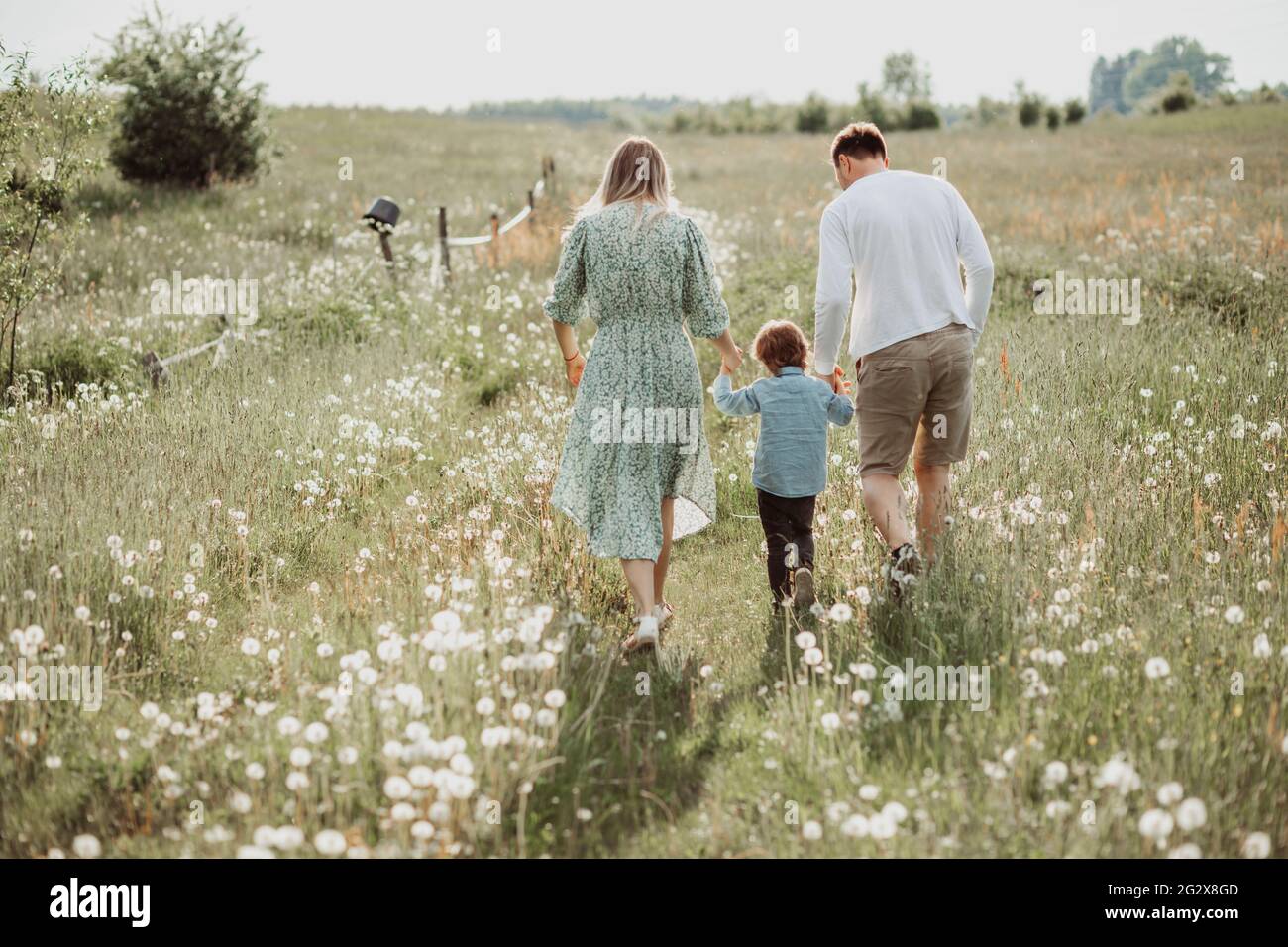Family with three boys on field hi-res stock photography and images - Alamy