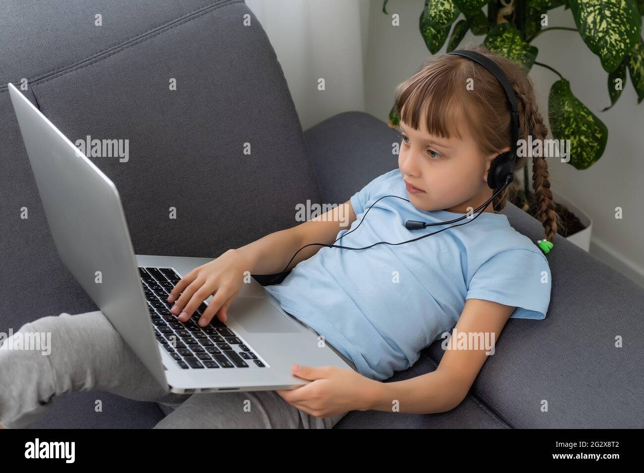 Homeschool little young girl student learning virtual internet online ...