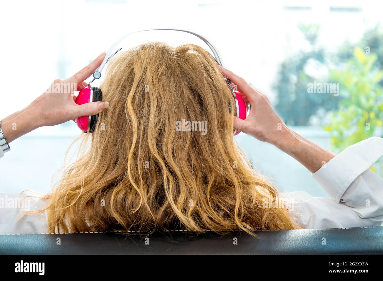 Girl headphones rear view hi-res stock photography and images - Alamy