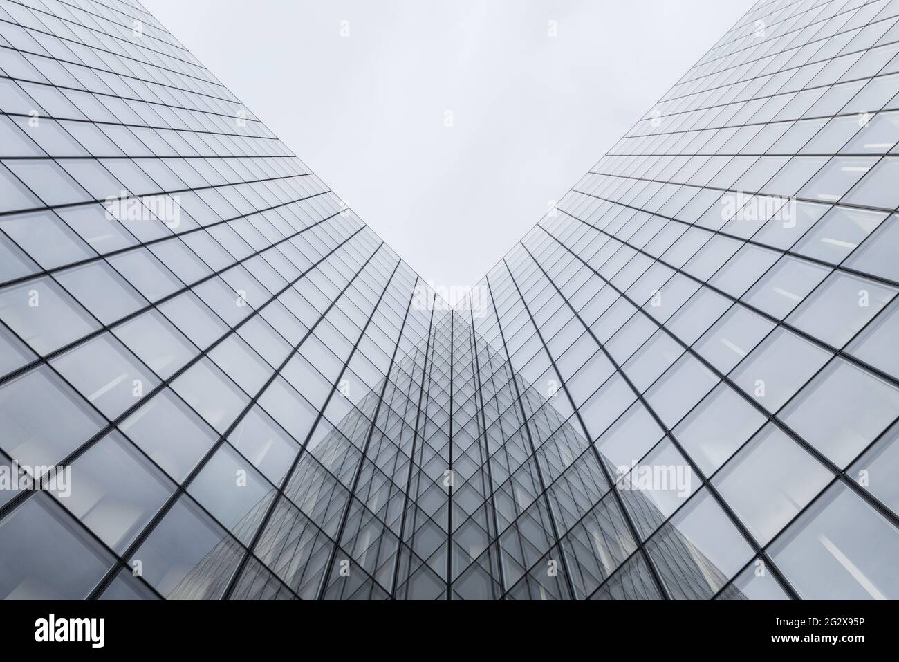 A low angle shot of a modern building with glass walls Stock Photo - Alamy