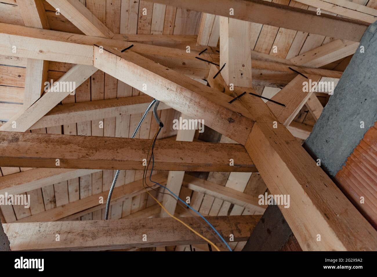 A view of a wooden rafter structure during construction Stock Photo - Alamy