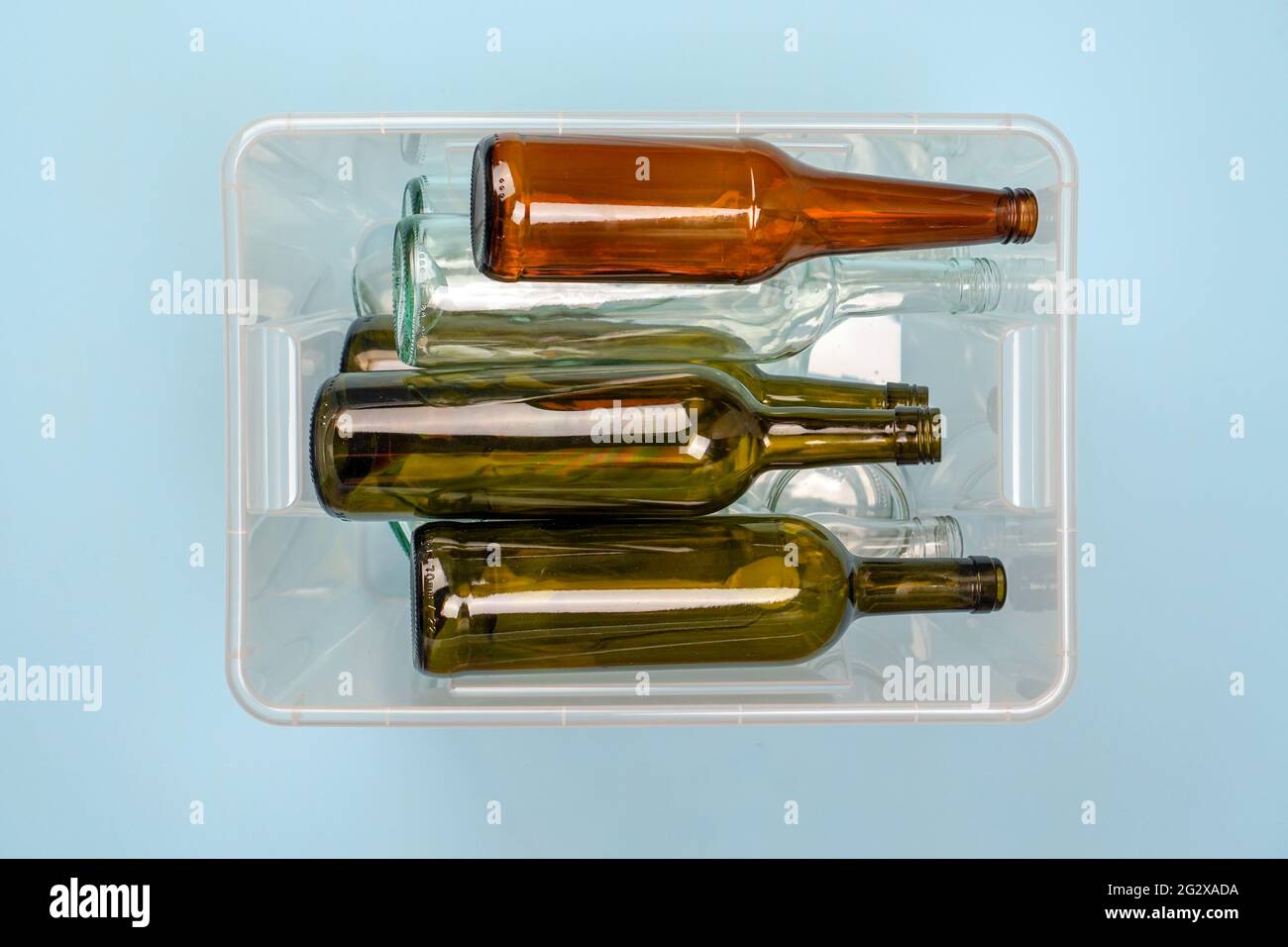 Sorting garbage. A container with glass bottles of wine and beer on a ...