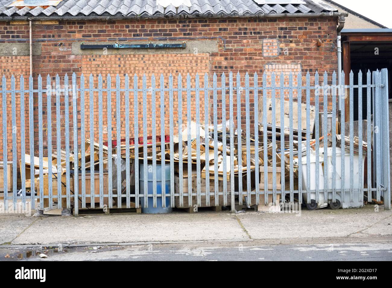 Cardboard and rubbish in waste compound for disposal at dump site Stock ...