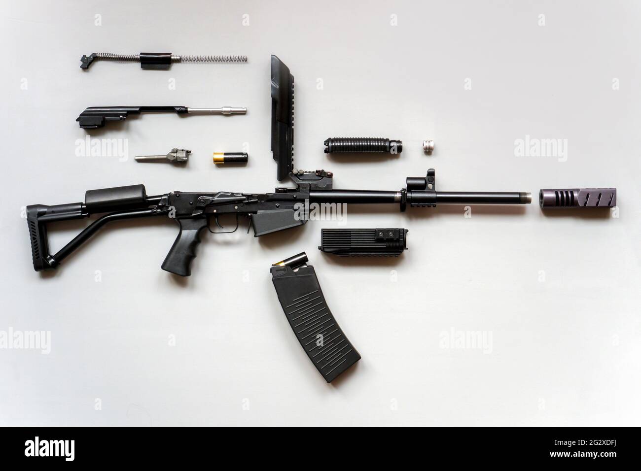 Disassembled machine gun on a gray background. Isolated. Details of ...