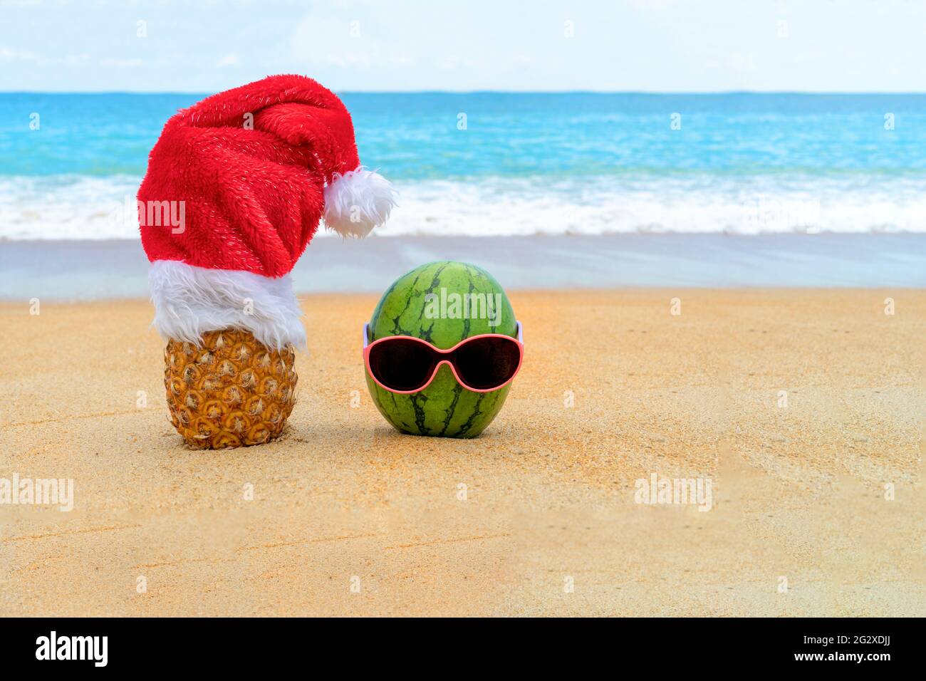 Picture of pineapple wearing Santa Claus hat and green cheerful ...