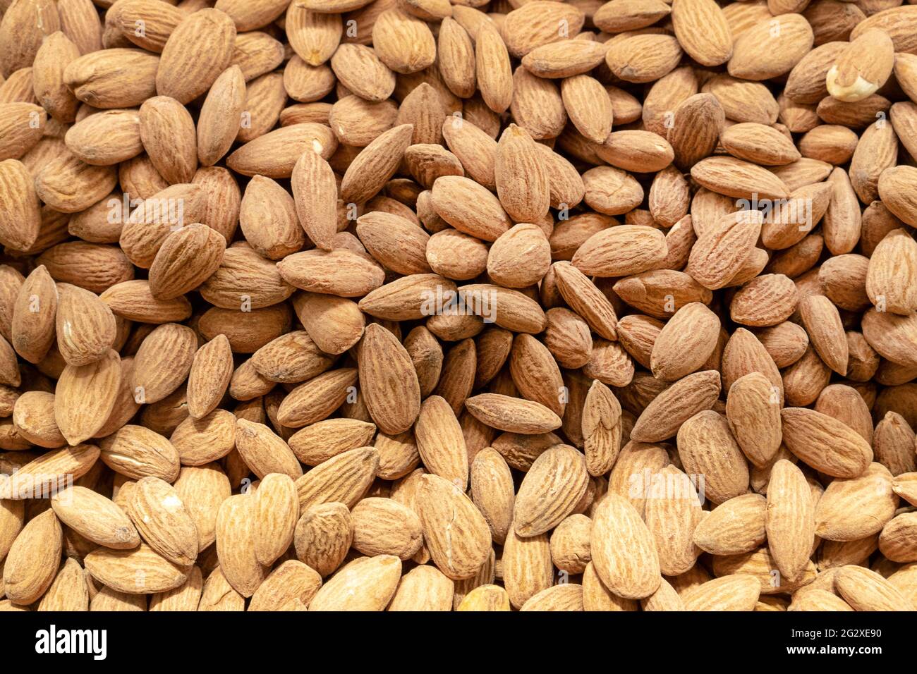 almonds plant dry seeds texture pattern background. Top view blur ...