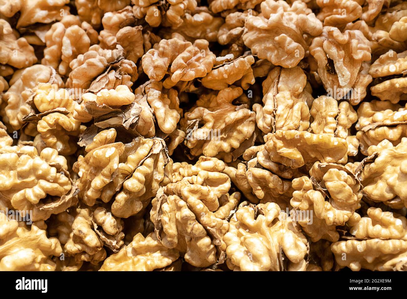 Walnuts with (filling the picture). Background of fresh broken walnuts ...