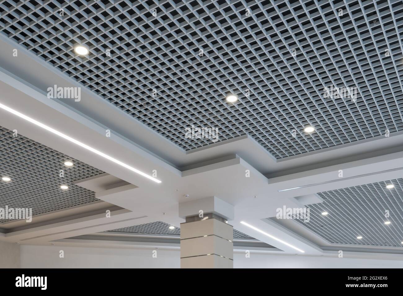 suspended and grid ceiling with halogen spots lamps and drywall ...