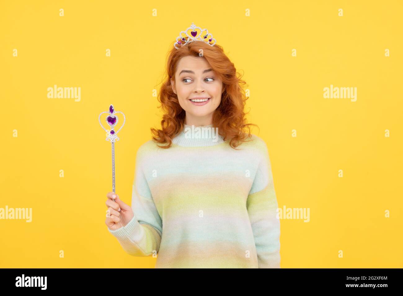 happy redhead woman in queen crown with magic wand, magic Stock Photo ...