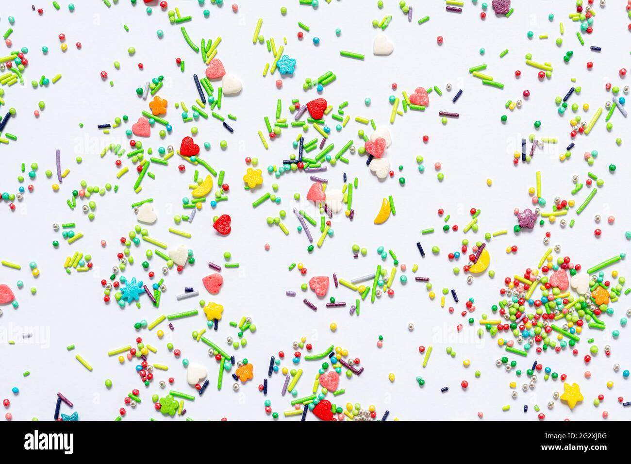 Bright background of multi-colored sweet sprinkles of different shapes ...