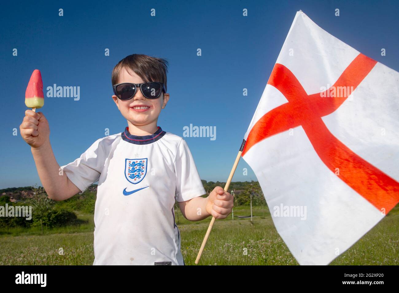 Cambridge. UK. 13th June 2021. Albert Mitchell, 4 in his England kit is ...