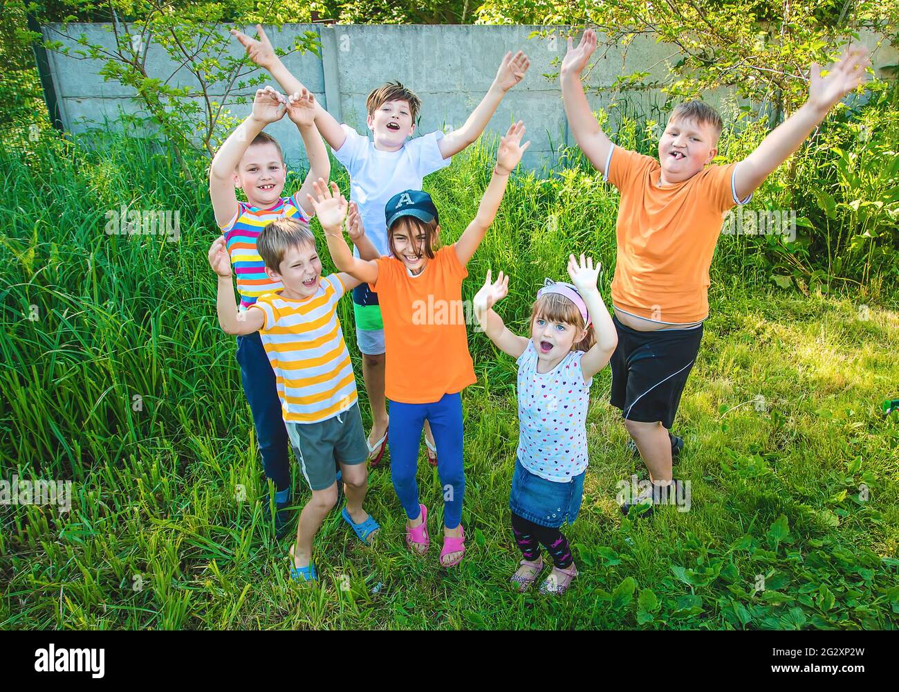 Children are having fun together on the street. Selective focus. Kids ...