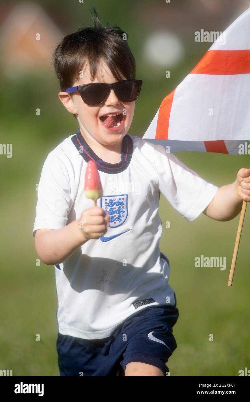 Cambridge. UK. 13th June 2021. Albert Mitchell, 4 in his England kit is ...