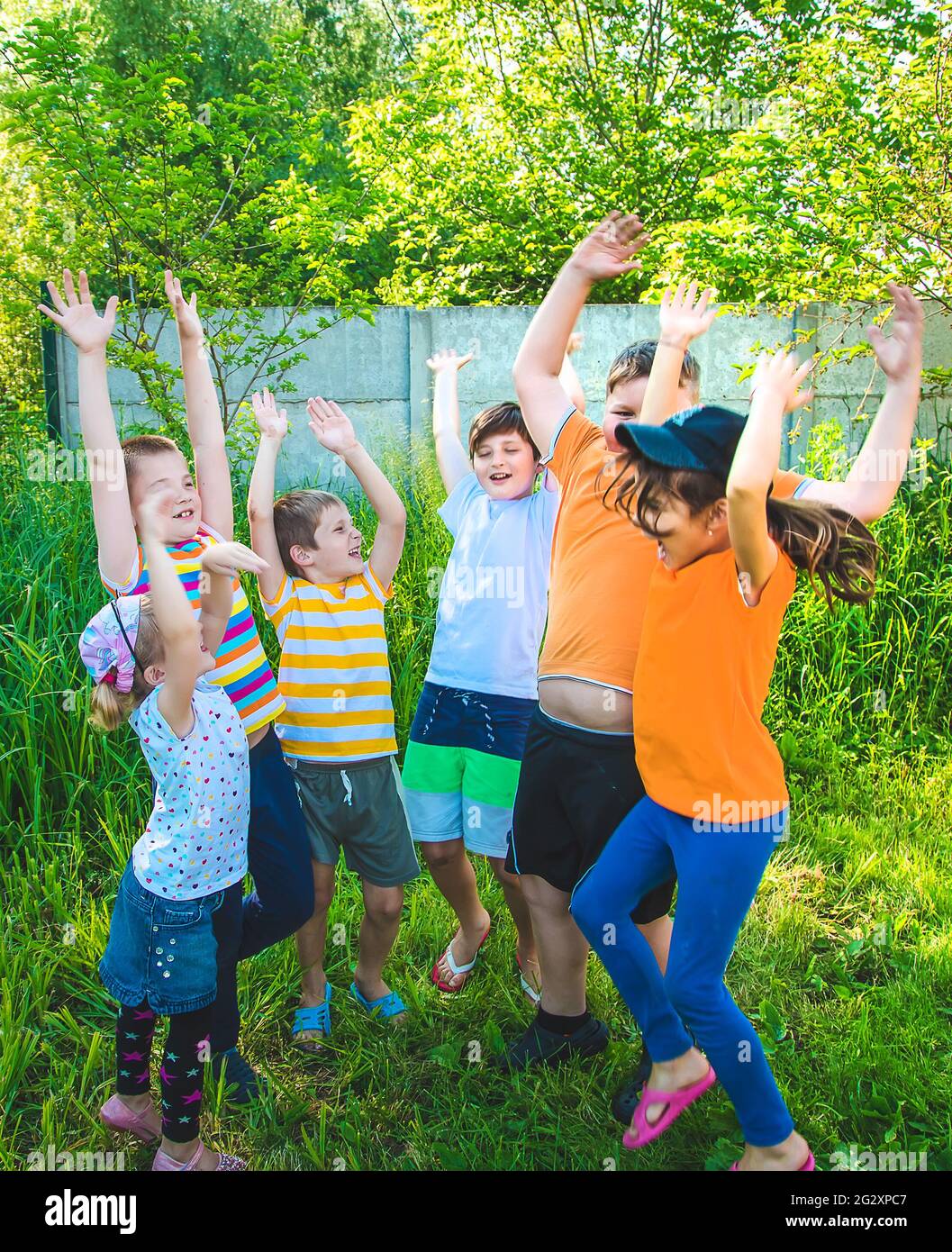 Children are having fun together on the street. Selective focus. Kids ...