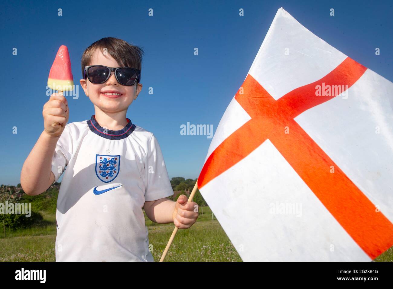 Cambridge. UK. 13th June 2021. Albert Mitchell, 4 in his England kit is ...