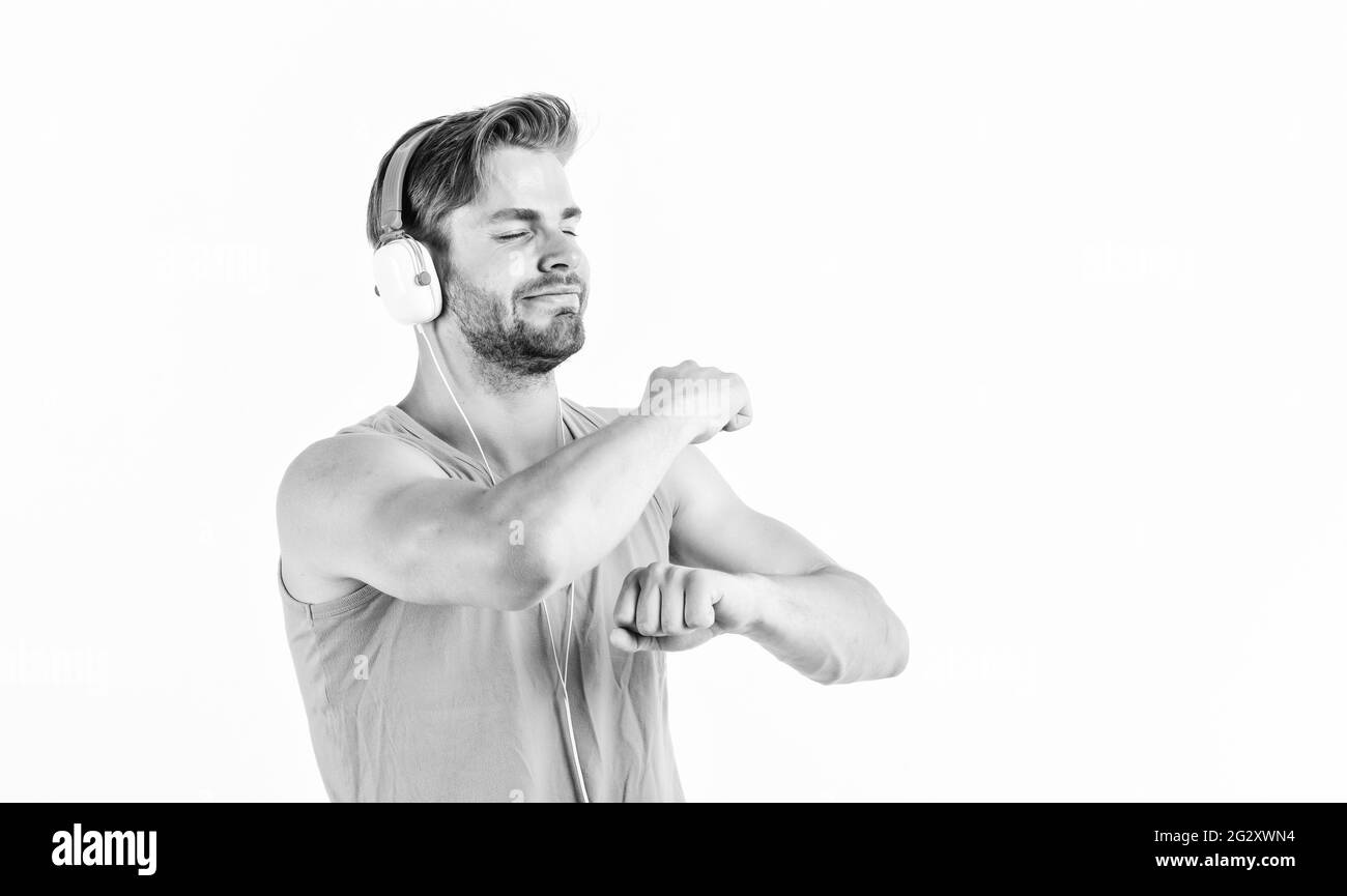 Songs for active leisure. Man listening music headphones and dance ...