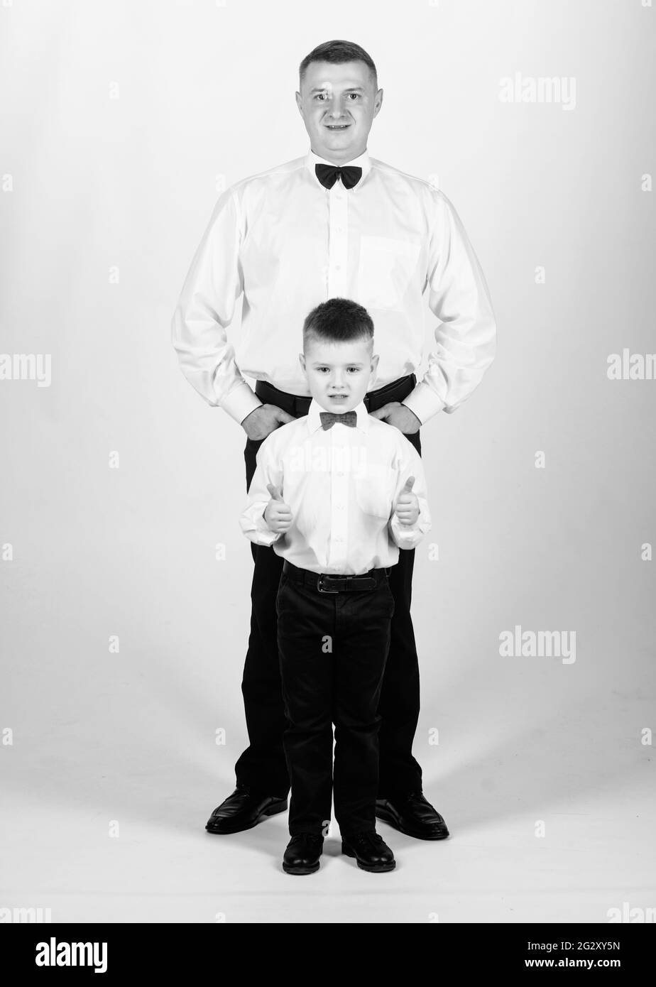 art director. father and son in formal suit. little boy with dad ...