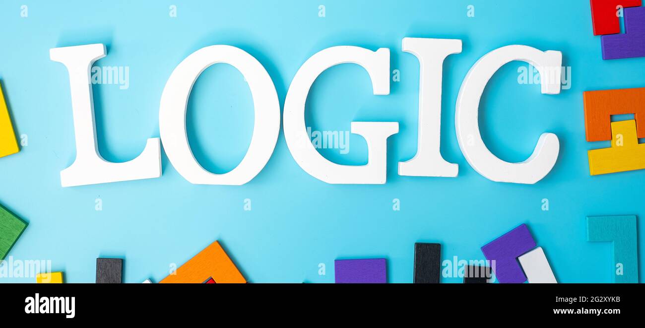 LOGIC text with colorful wood puzzle pieces, geometric shape block on ...