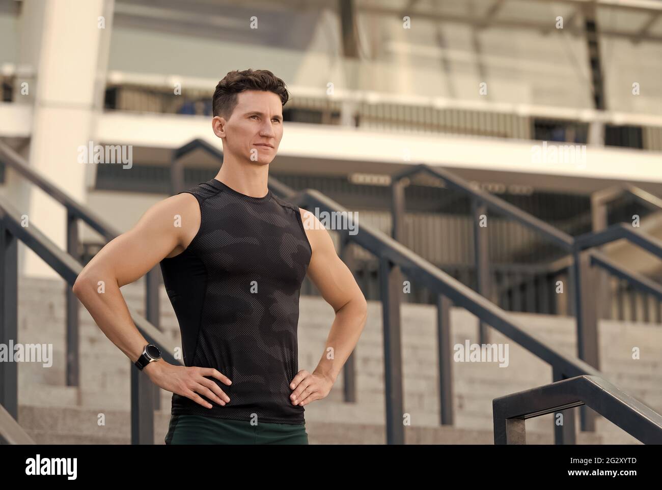 Man muscular shoulders motivated for workout urban background Stock ...